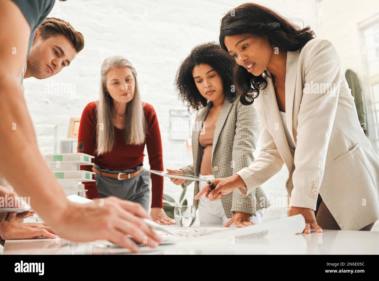Group of architects talking building plan. Group of engineers ...