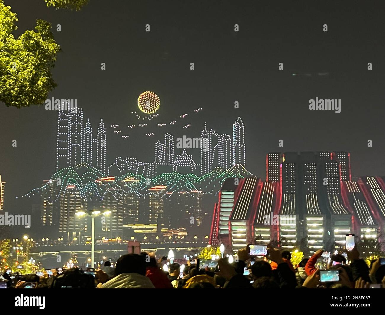 CHONGQING, CHINA - JANUARY 21, 2023 - (FILE) Tourists watch a drone ...