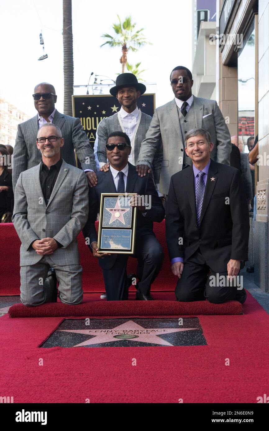 Back row, from left, LA Read, Usher, and Sean Combs, attend as Kenny ...