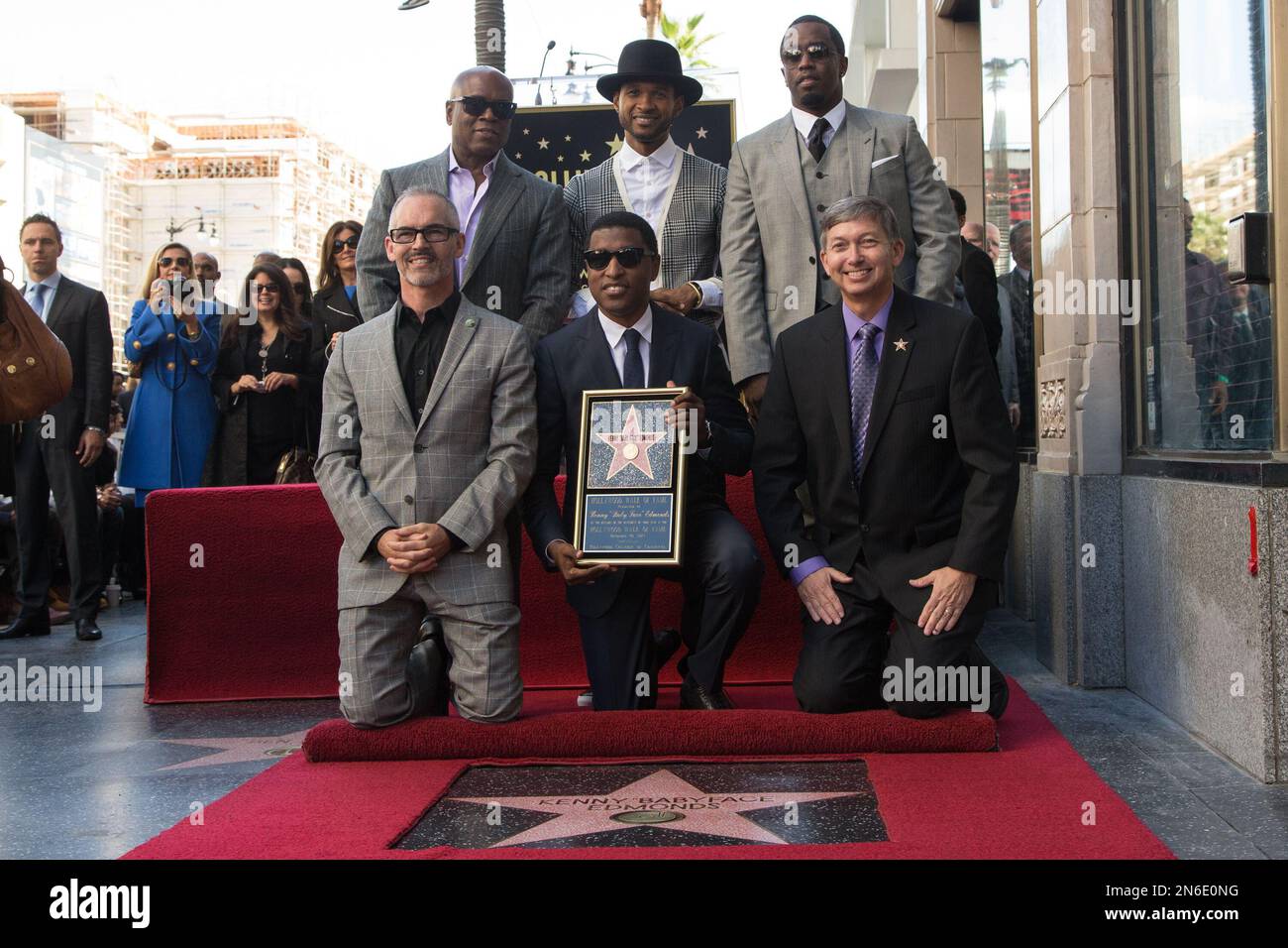 Back row, from left, LA Read, Usher, and Sean Combs, attend as Kenny ...