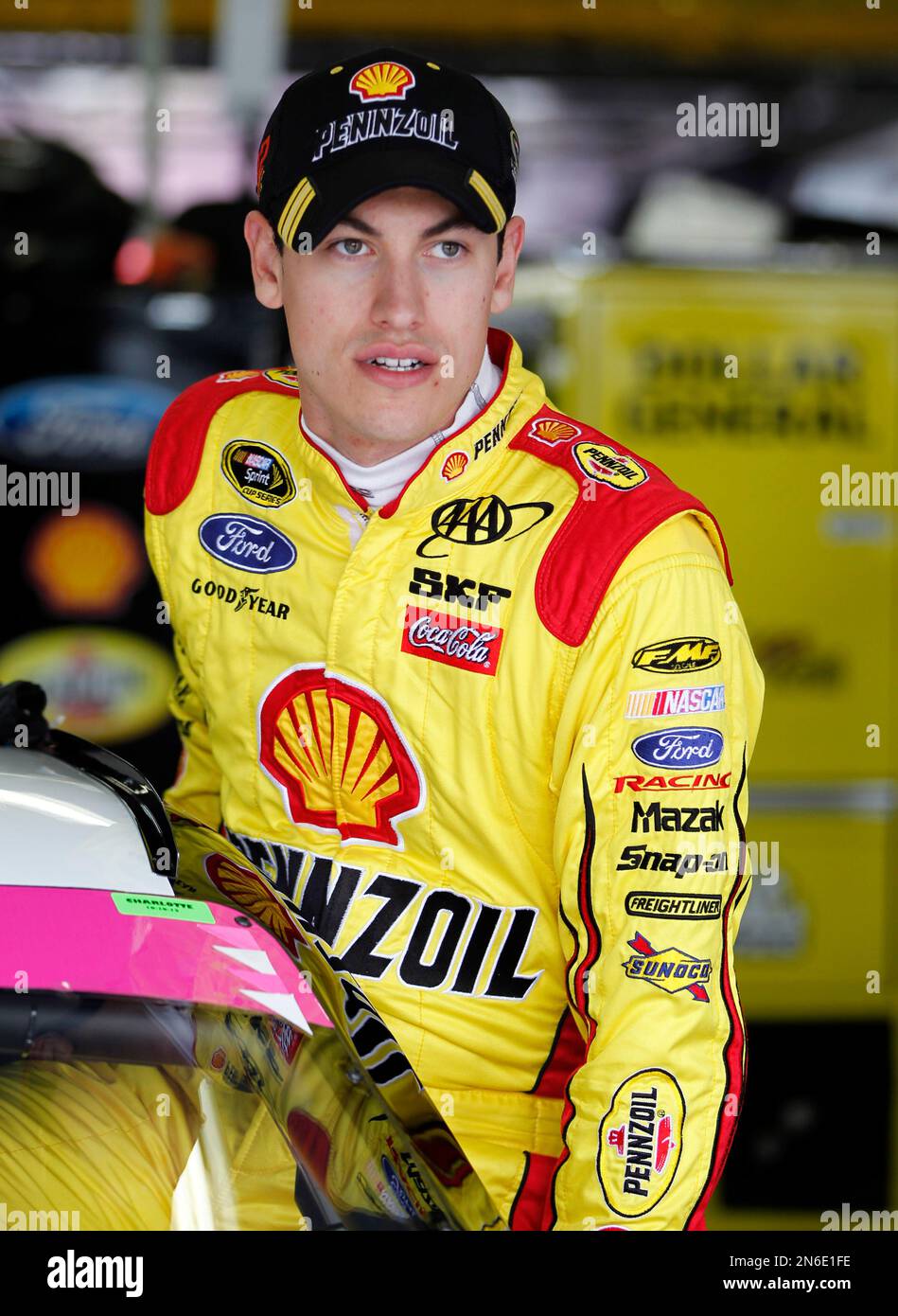 Joey Logano climb into his car before practice for Friday's NASCAR ...