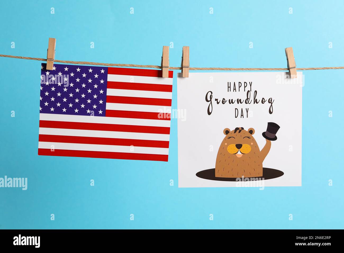 Happy Groundhog Day greeting card and American flag hanging on light ...