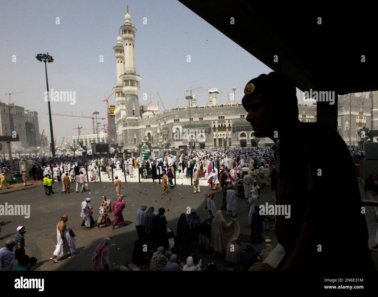 A Saudi policeman watches an area near the Grand Mosque in the Muslim ...