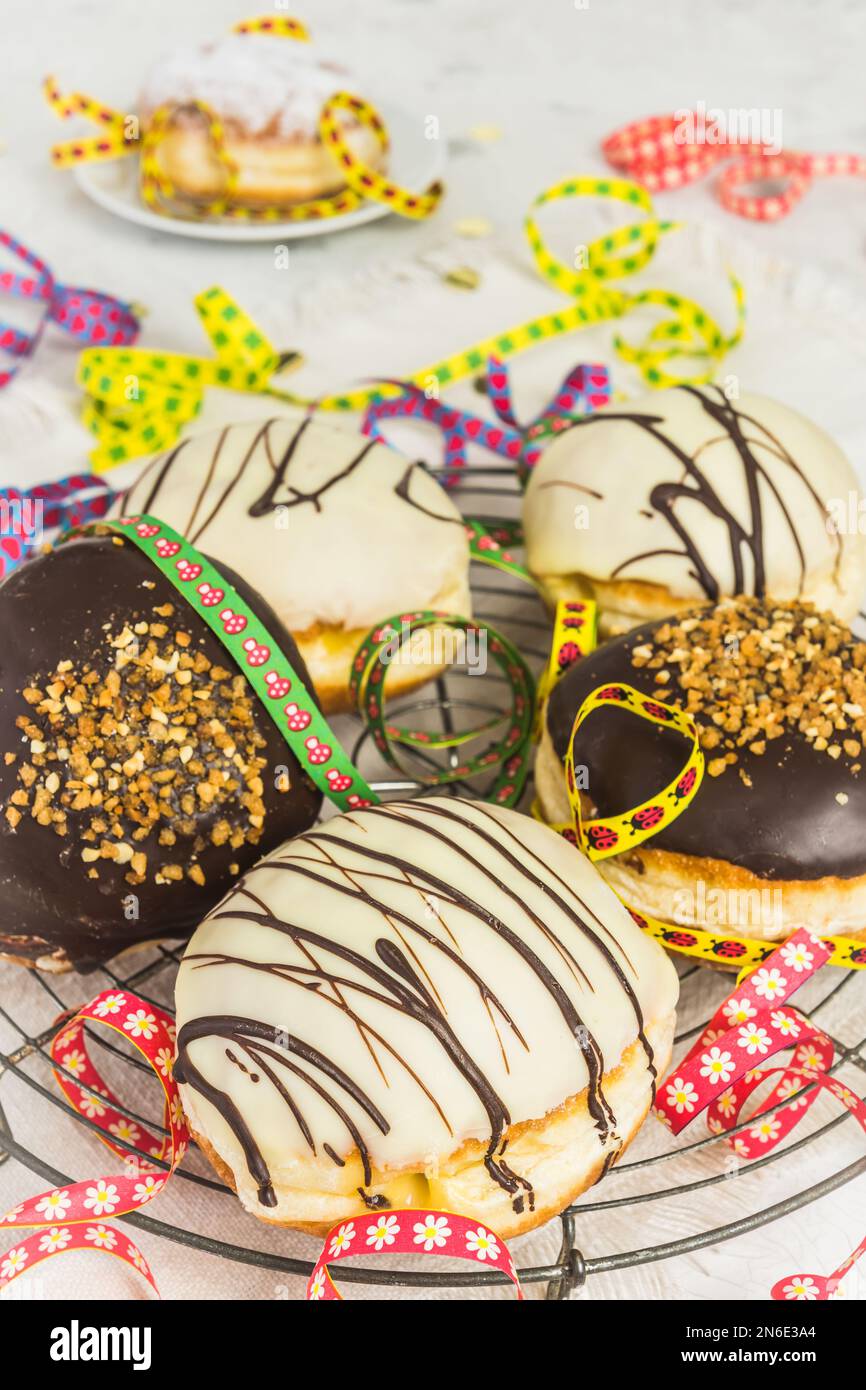 Traditional german Berliner pastries glazed with dark and white ...