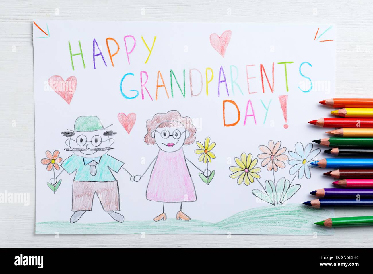 Beautiful drawing with phrase Happy Grandparents Day on white wooden ...