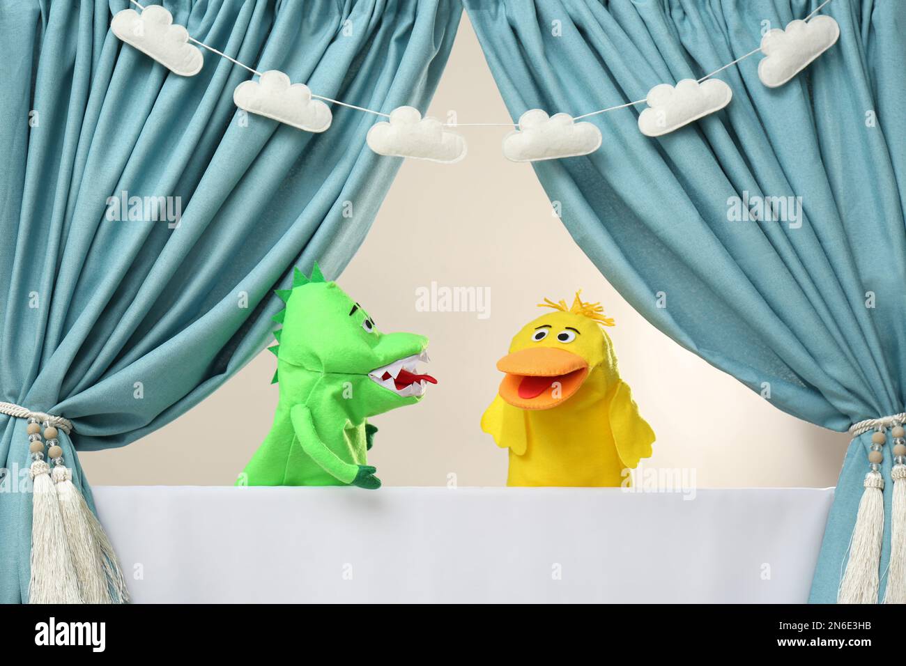 Creative puppet show on white stage indoors Stock Photo - Alamy