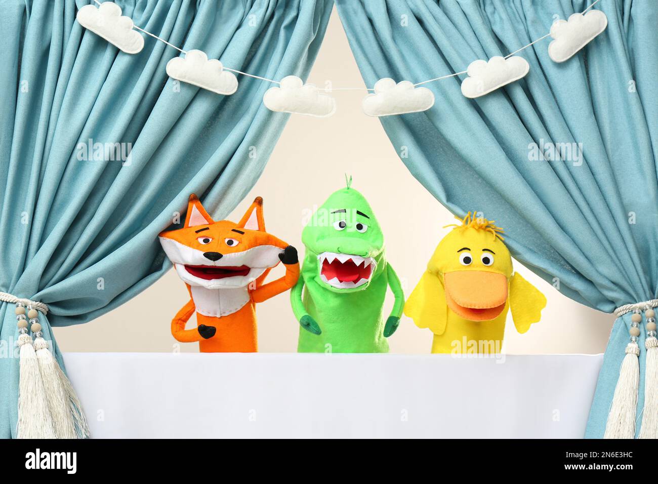 Creative puppet show on white stage indoors Stock Photo - Alamy