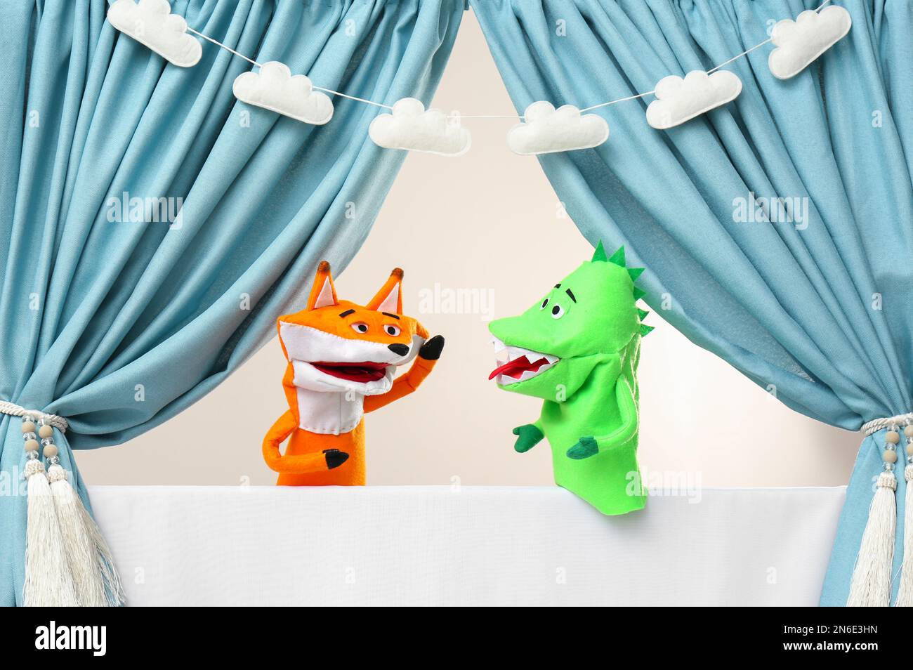 Creative puppet show on white stage indoors Stock Photo - Alamy