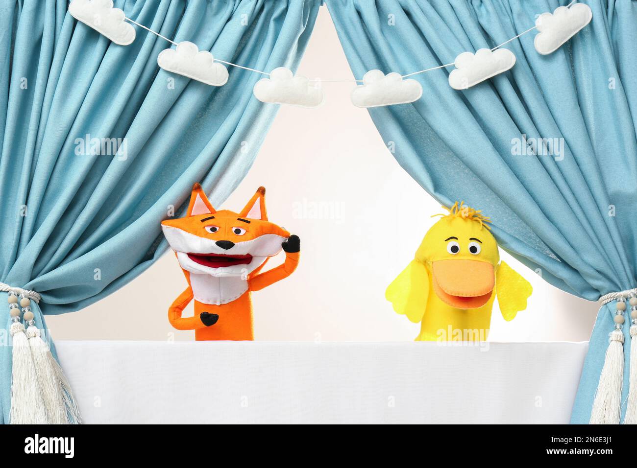 Creative puppet show on white stage indoors Stock Photo - Alamy