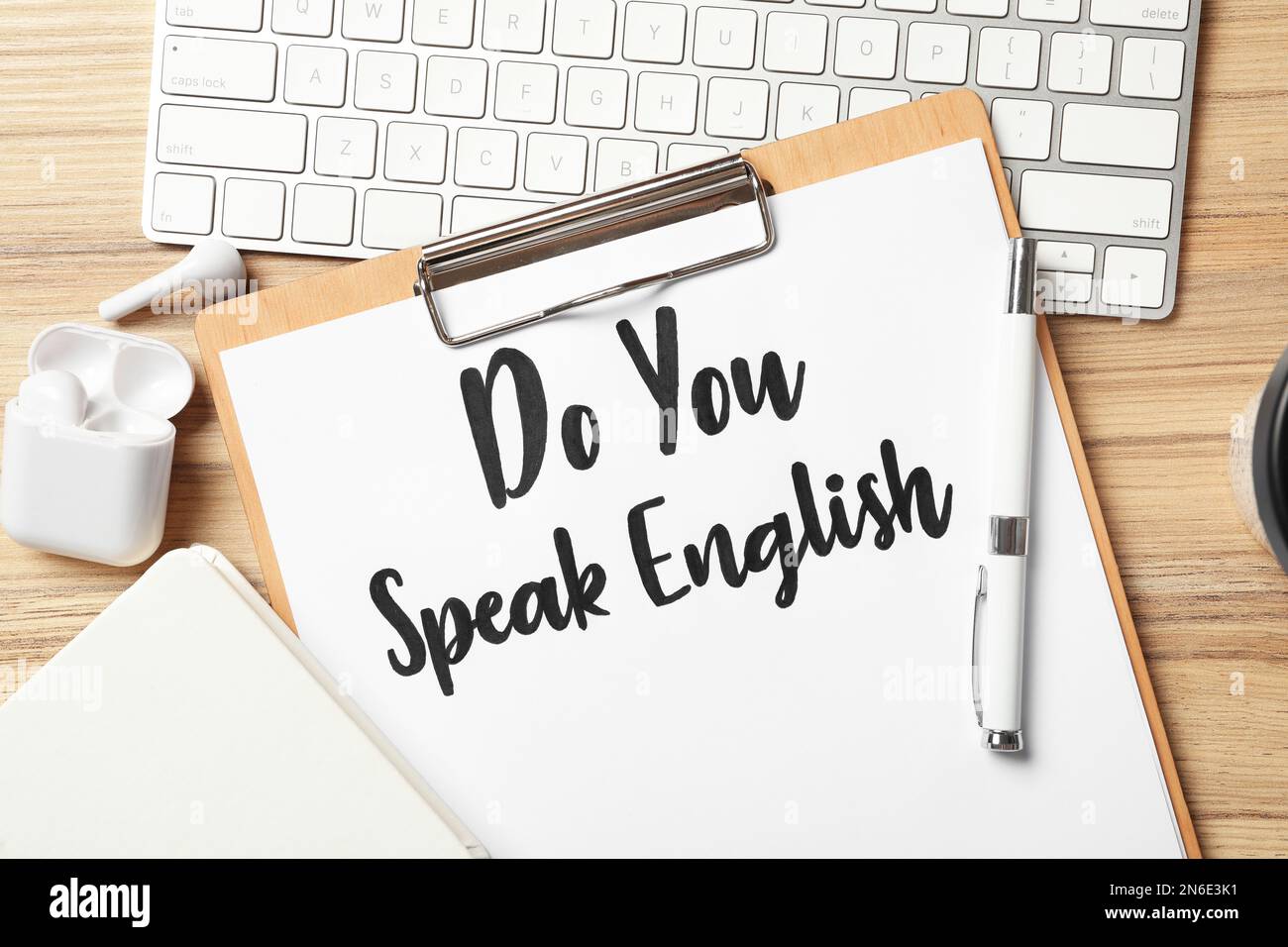 Clipboard with question Do You Speak English and stationery on wooden ...