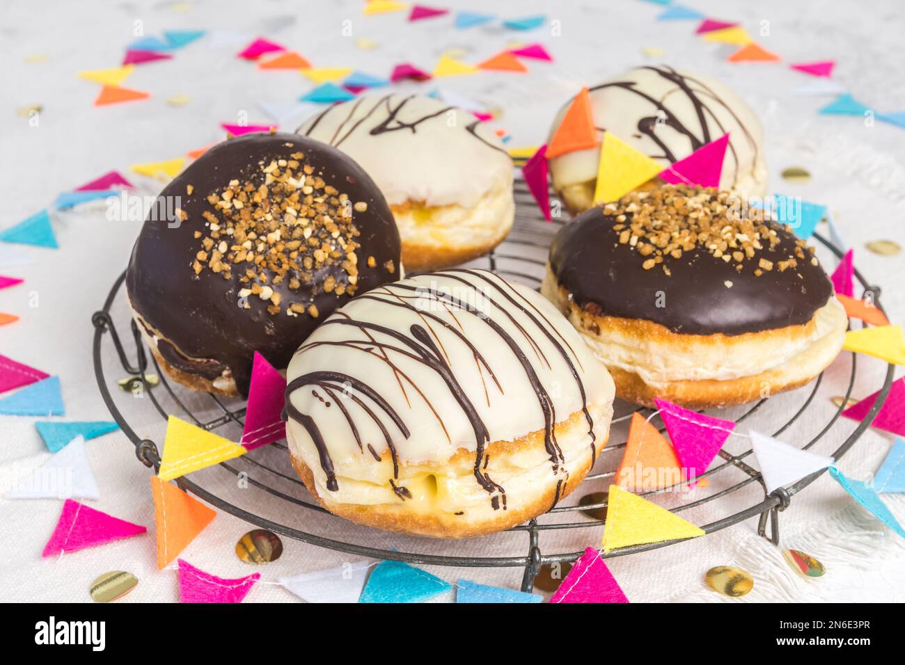 Traditional german Berliner pastries glazed with dark and white ...