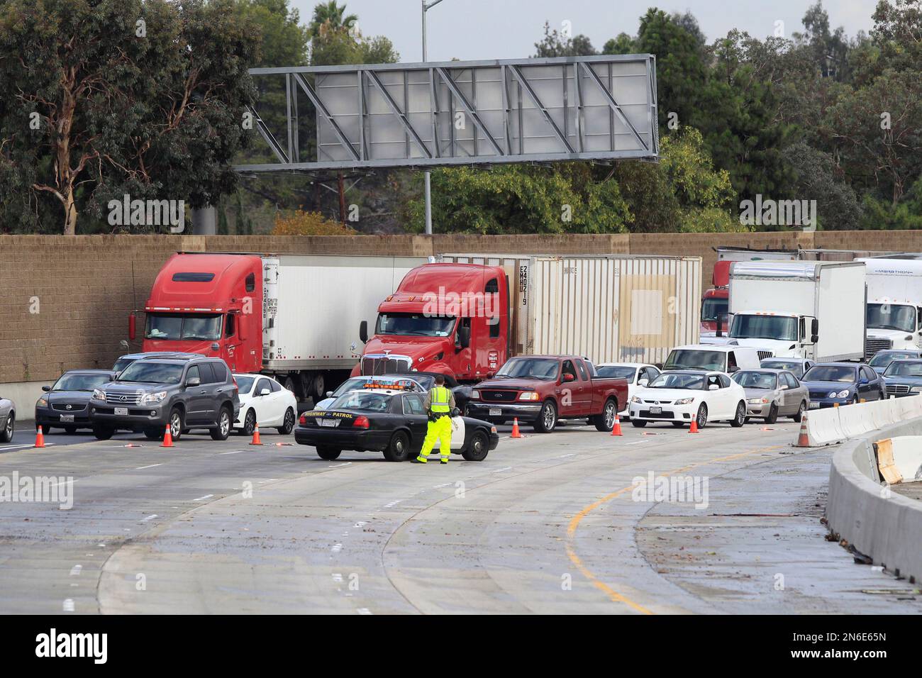 California Highway Patrol CHP officers divert traffic off the ...
