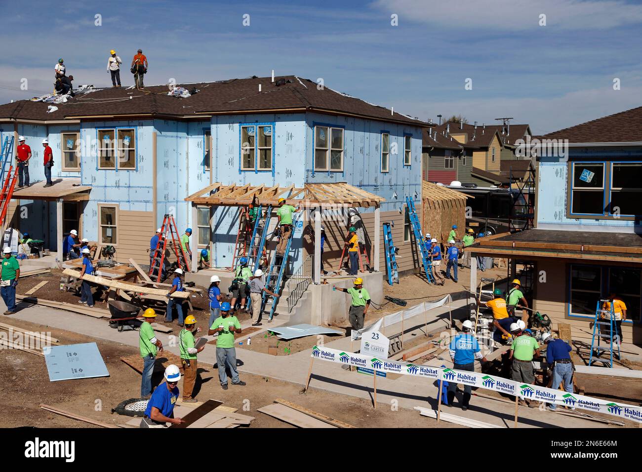Former President Jimmy Carter, far bottom right, helps carpenters build ...