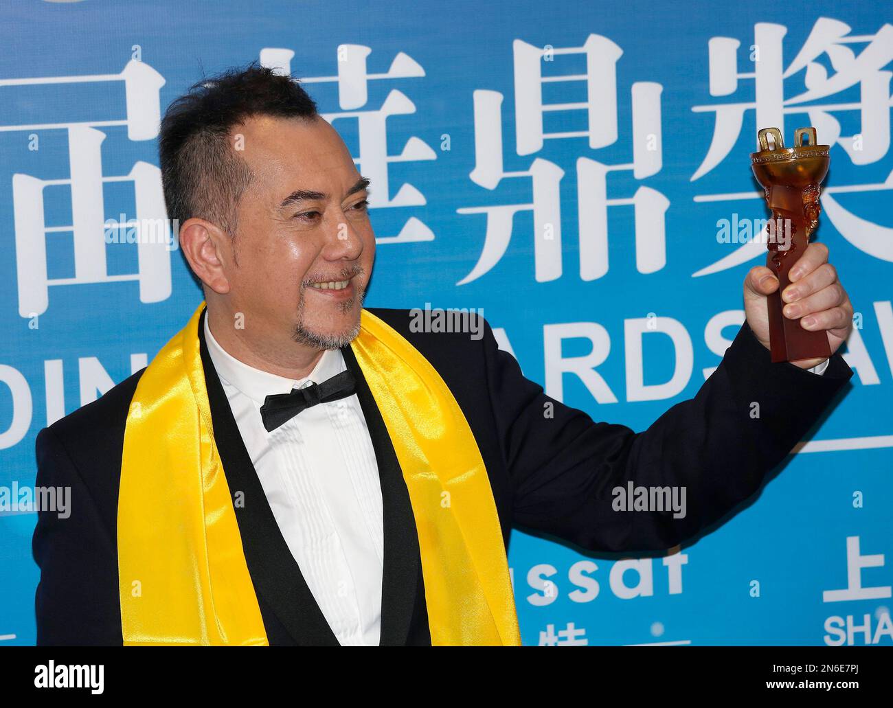 Hong Kong actor Anthony Wong poses with his trophy after winning the ...