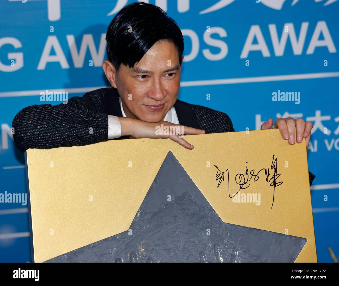 Hong Kong actor Nick Cheung poses after made a print of his hands at ...