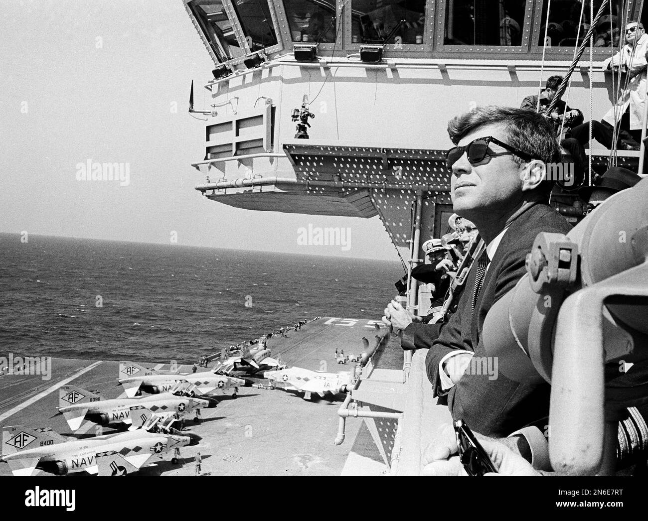 President John F. Kennedy watches from the island of the USS Enterprise ...