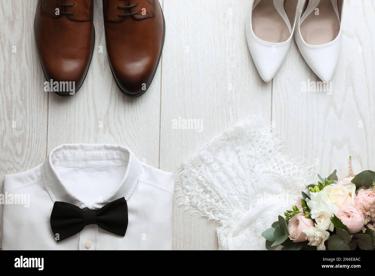 Flat lay composition with wedding shoes for bride and groom on white ...