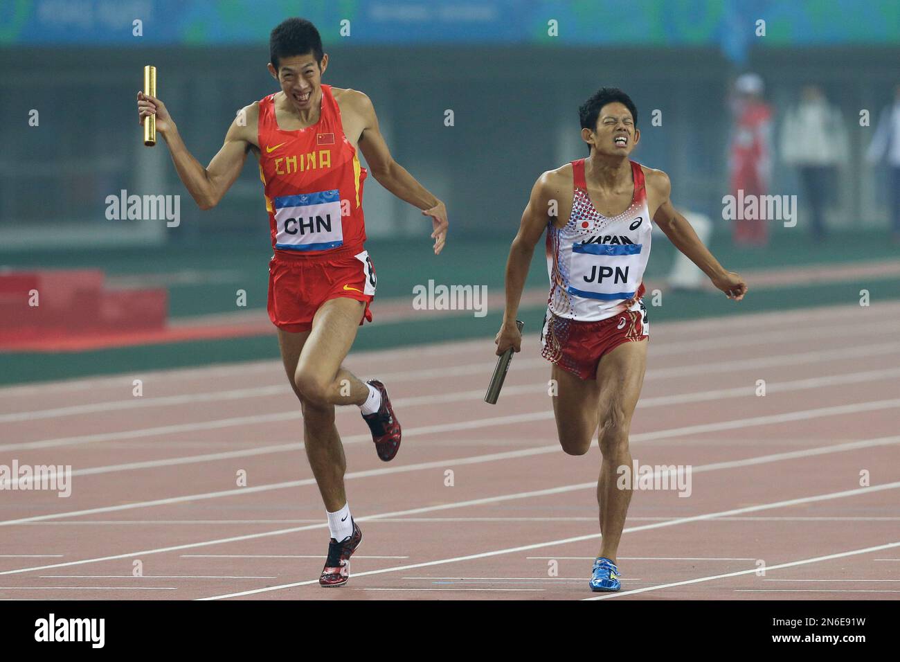 China's Chen Jinaxin, left, and Japan's Keisuke Nozawa race to the ...