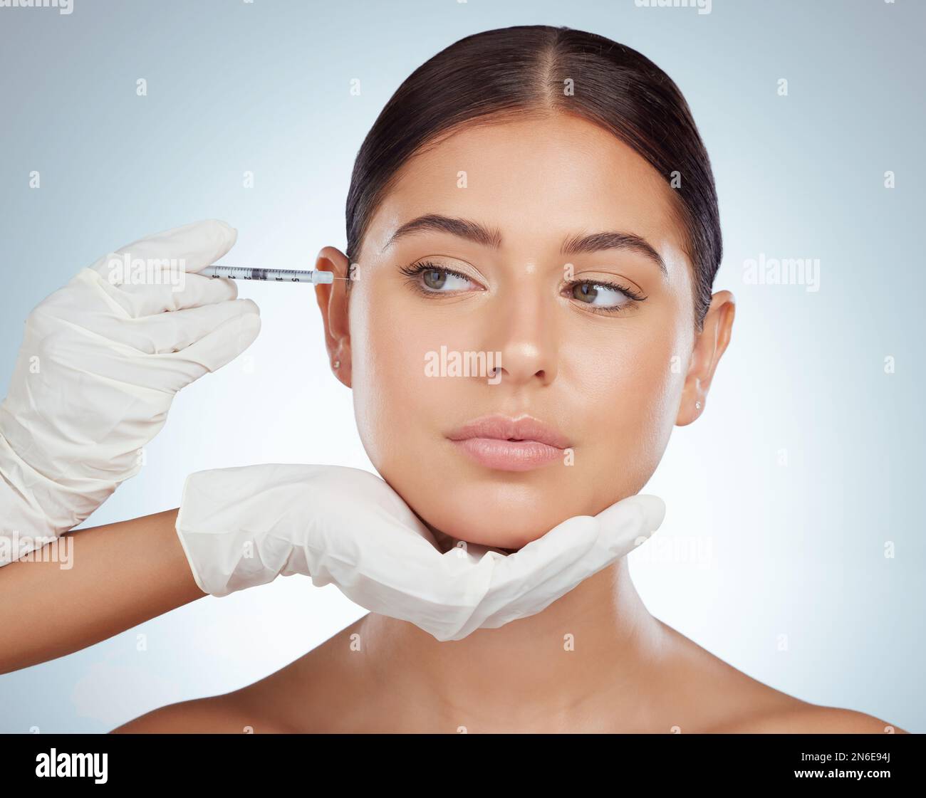 Beautiful woman getting facial fillers or botox. Young caucasian model ...