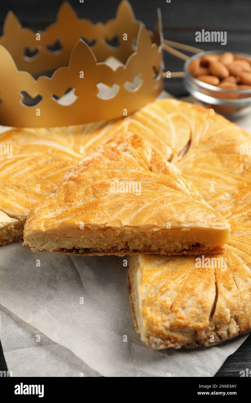 Traditional galette des Rois with paper crown on table, closeup Stock ...