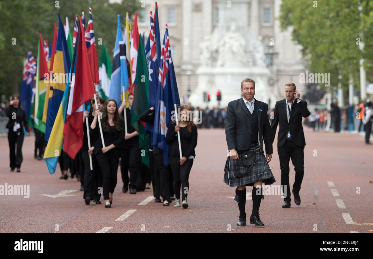 Former British Olympian Sir Chris Hoy looks to the crowd as he walks ...