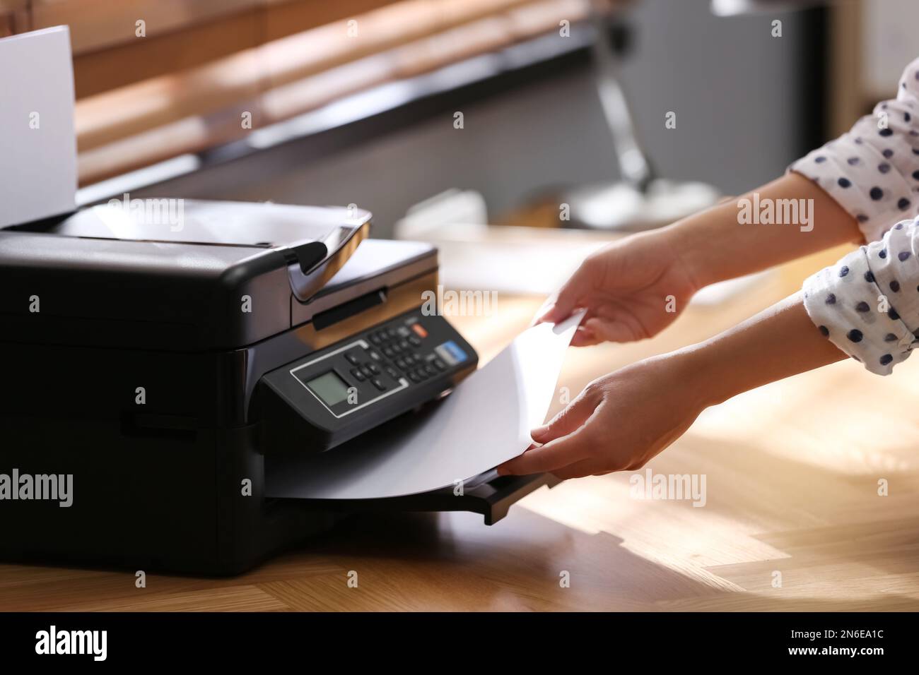 Employee using modern printer in office, closeup Stock Photo - Alamy