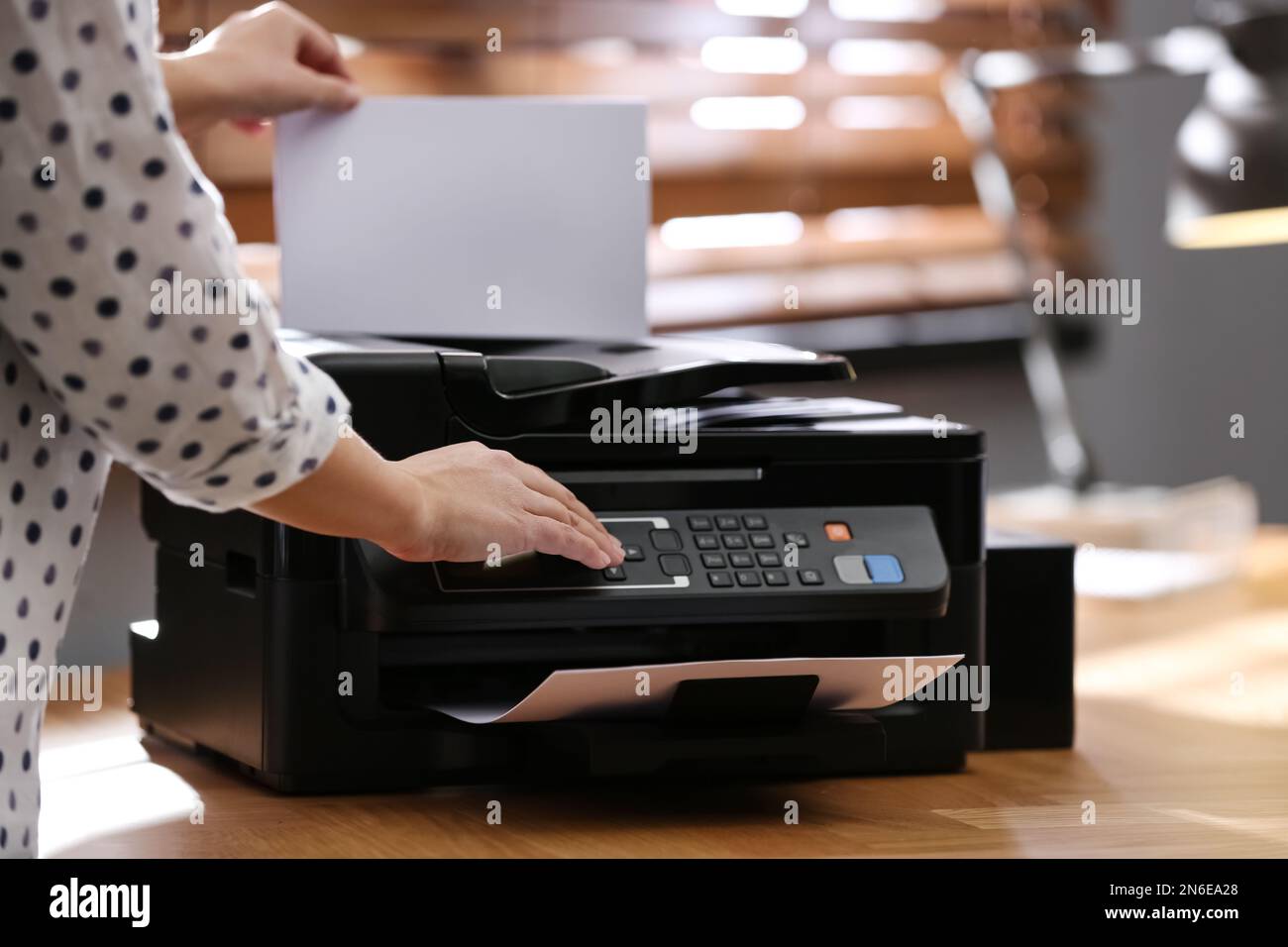 Employee using modern printer in office, closeup Stock Photo - Alamy