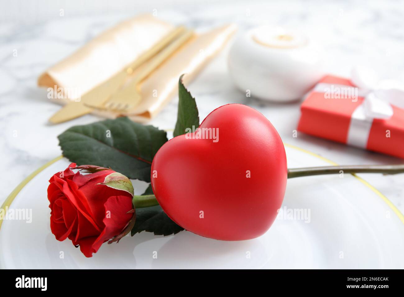 Beautiful table setting with decorative heart, closeup view. Valentine's day romantic dinner ...