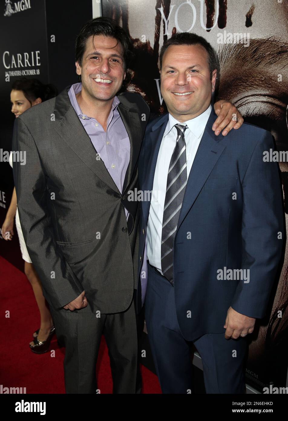 Jonathan Glickman, left, and Kevin Misher pose together on the red ...