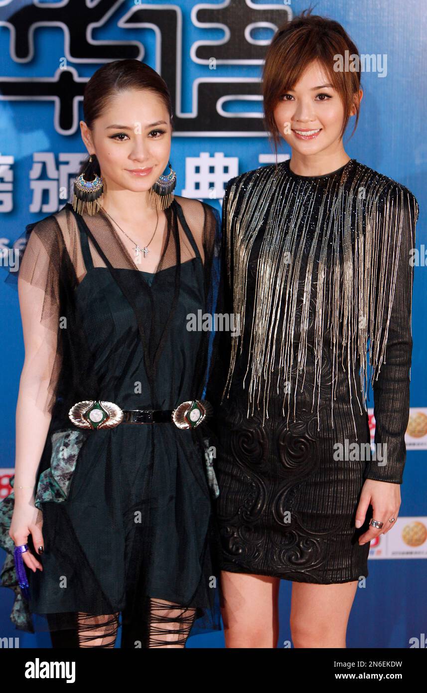 Hong Kong singers Gillian Chung, left, and Charlene Choi pose for ...