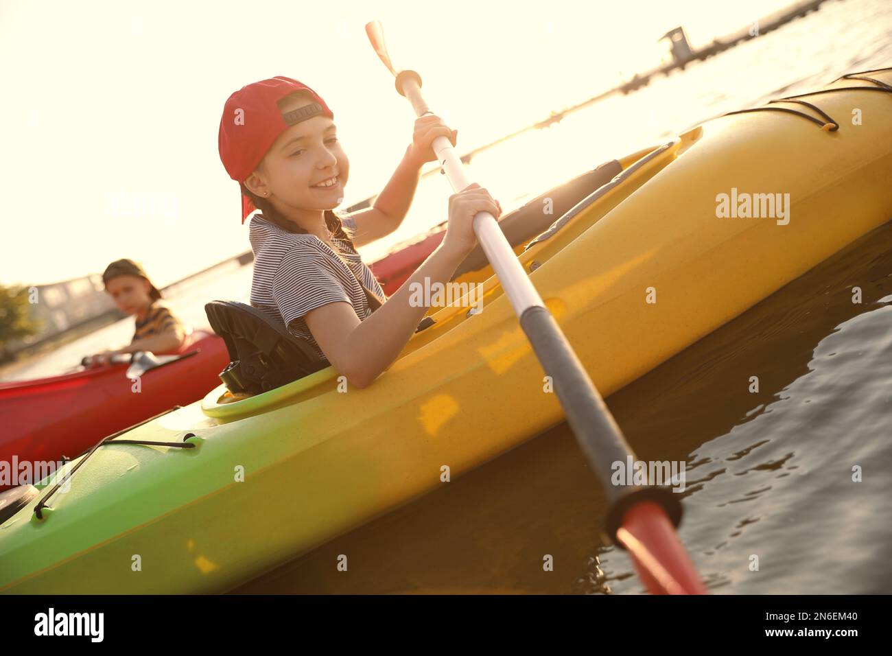 Little children kayaking on river. Summer camp activity Stock Photo - Alamy