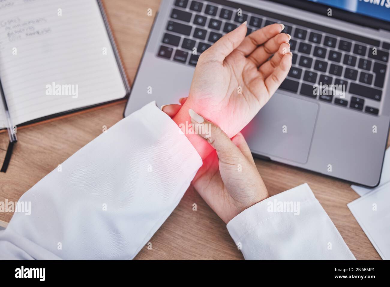 Hands, woman and wrist with joint pain, laptop at desk from typing in ...