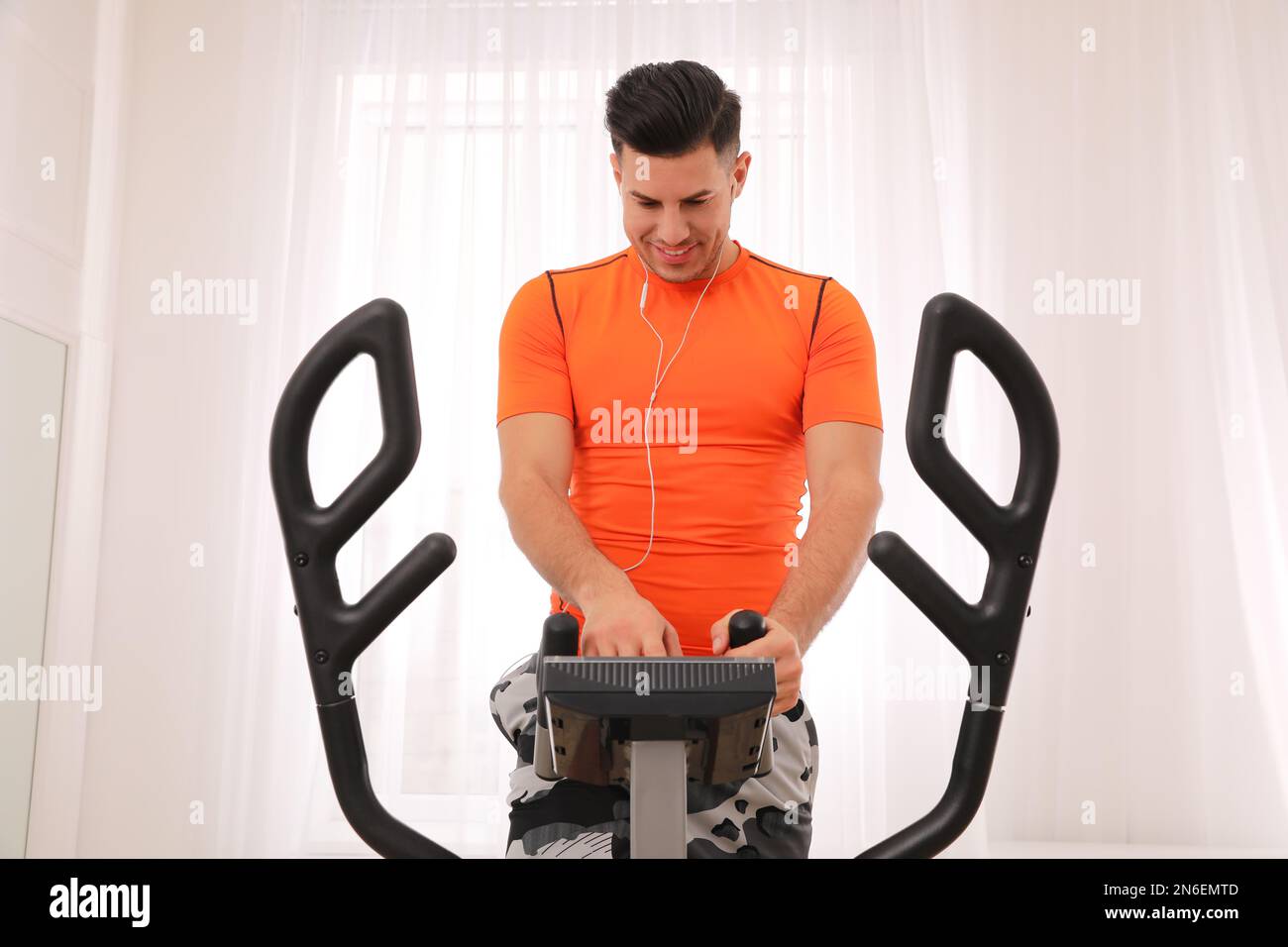 Man using modern elliptical hi-res stock photography and images - Alamy