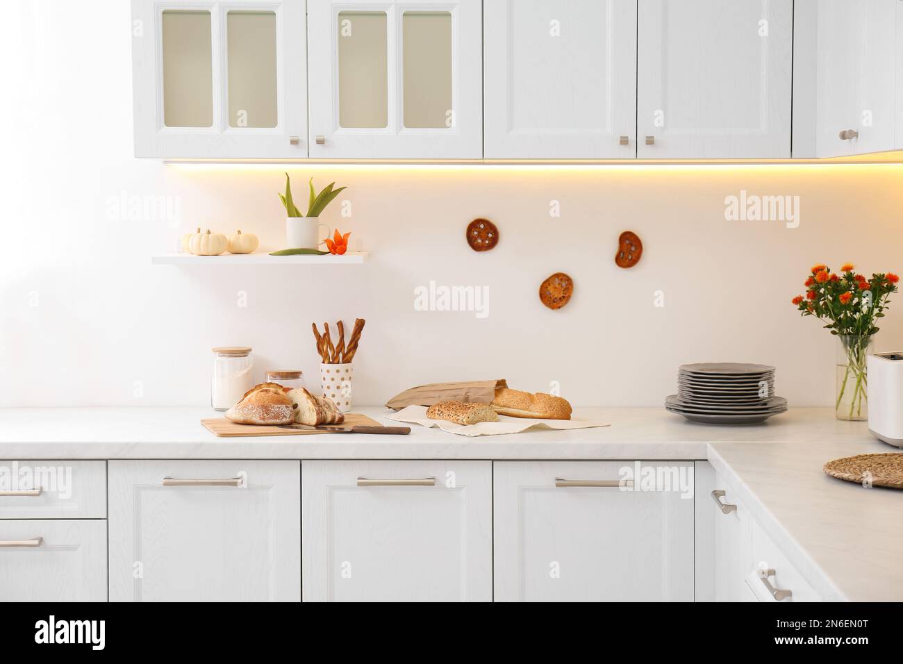 Modern kitchen interior with products on counter Stock Photo - Alamy