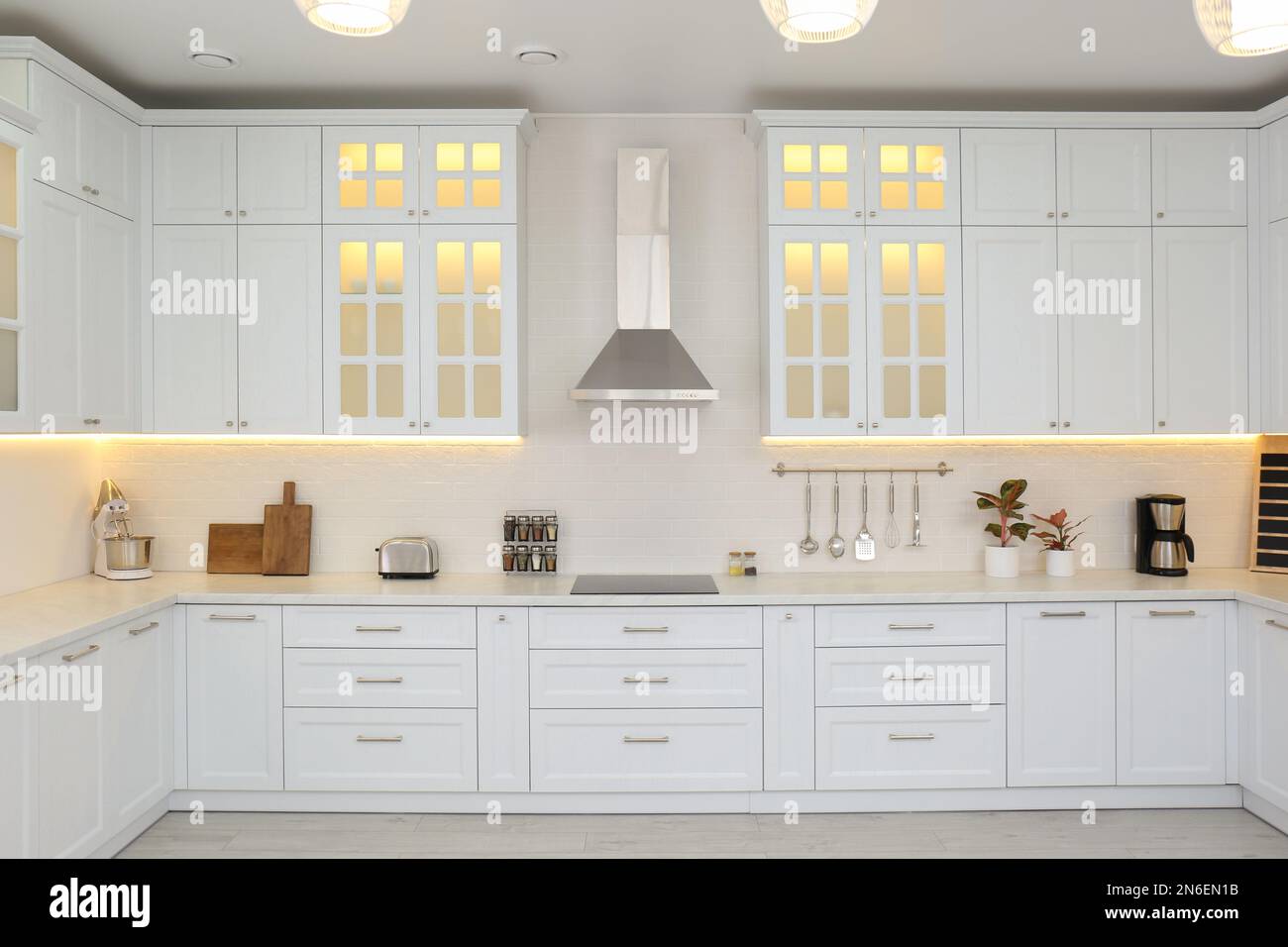 Modern toaster and household appliances on counter in kitchen Stock ...