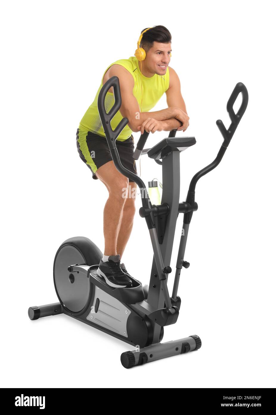 Man using modern elliptical machine on white background Stock Photo - Alamy