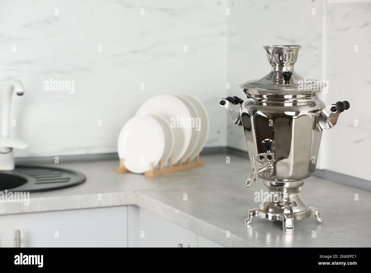 Metal samovar on grey countertop in kitchen. Russian tea culture Stock ...