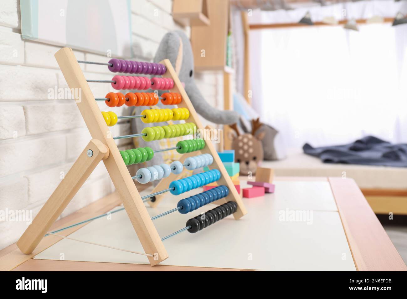 Colorful toy abacus on table in child's room. Space for text Stock ...