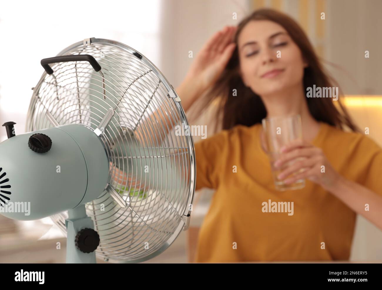 Woman electric fan water hi-res stock photography and images - Alamy