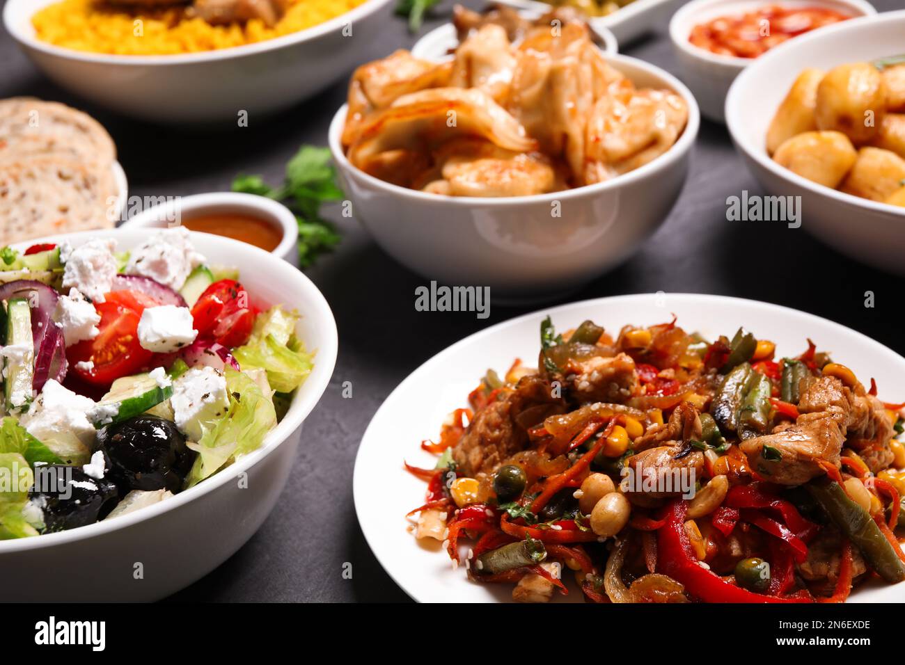 Buffet service. Many different dishes on grey table Stock Photo - Alamy