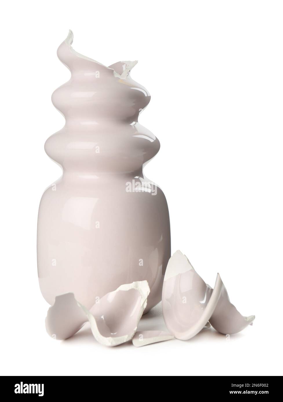 Broken pink ceramic vase isolated on white Stock Photo - Alamy