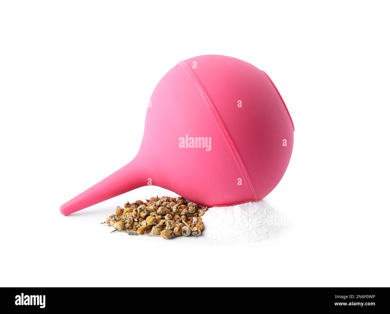 Pink enema, soda powder and dry chamomile flowers on white background ...