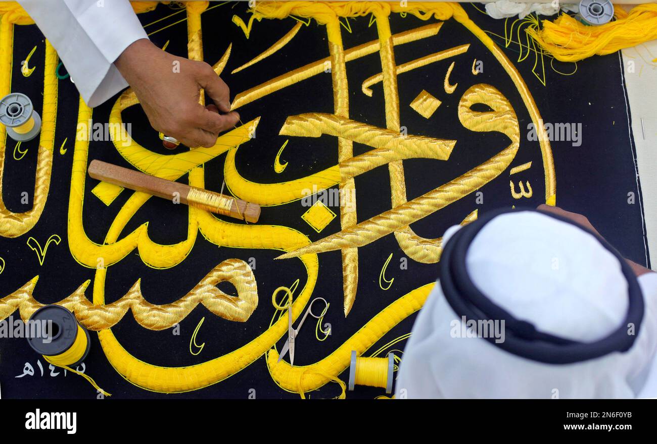 Saudi workers embroider Islamic calligraphy, using either pure silver ...