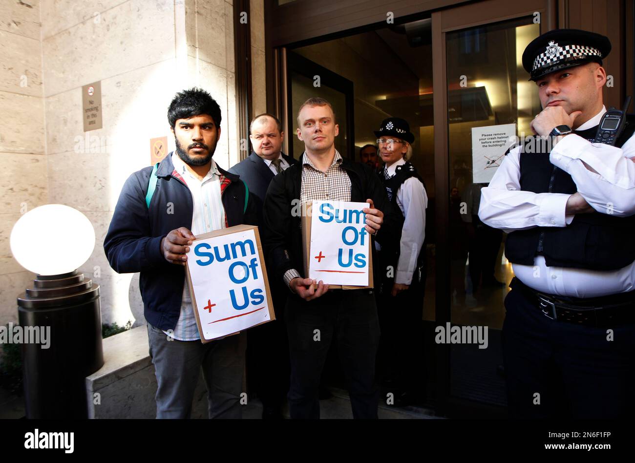 Two demonstrators hand over boxes of petitions, during a 'Daily Mail ...