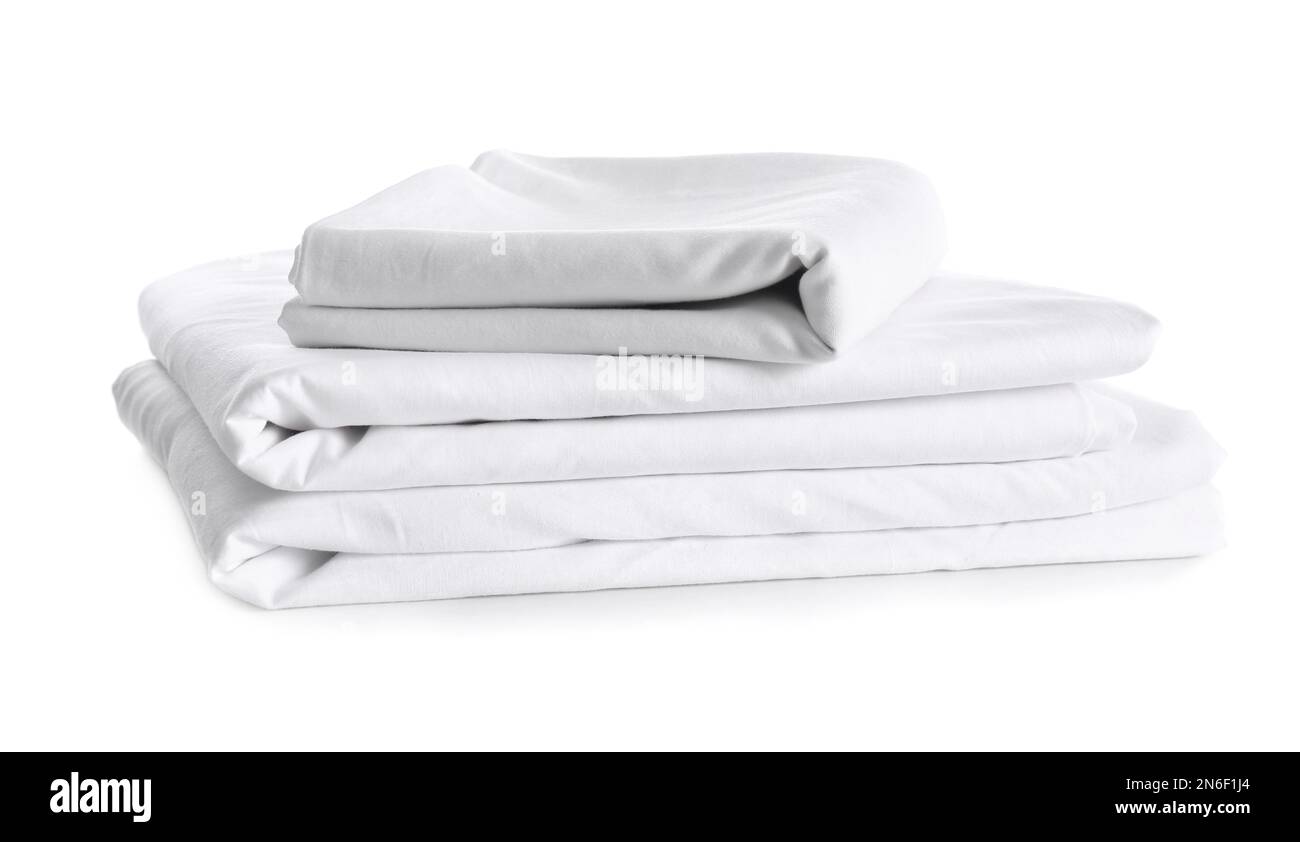 Stack of clean bed linen isolated on white Stock Photo - Alamy