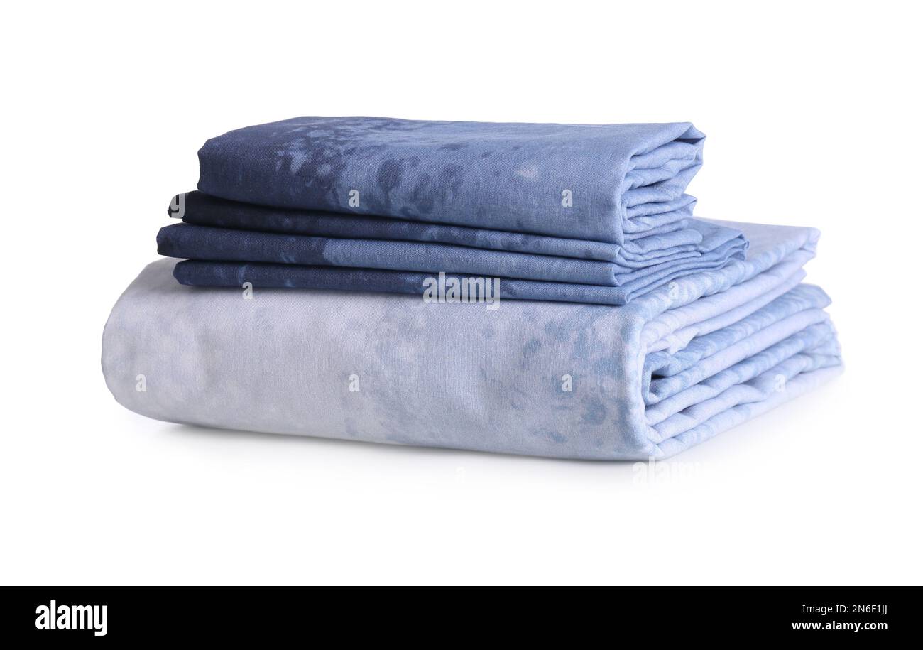 Stack of clean bed linen isolated on white Stock Photo - Alamy