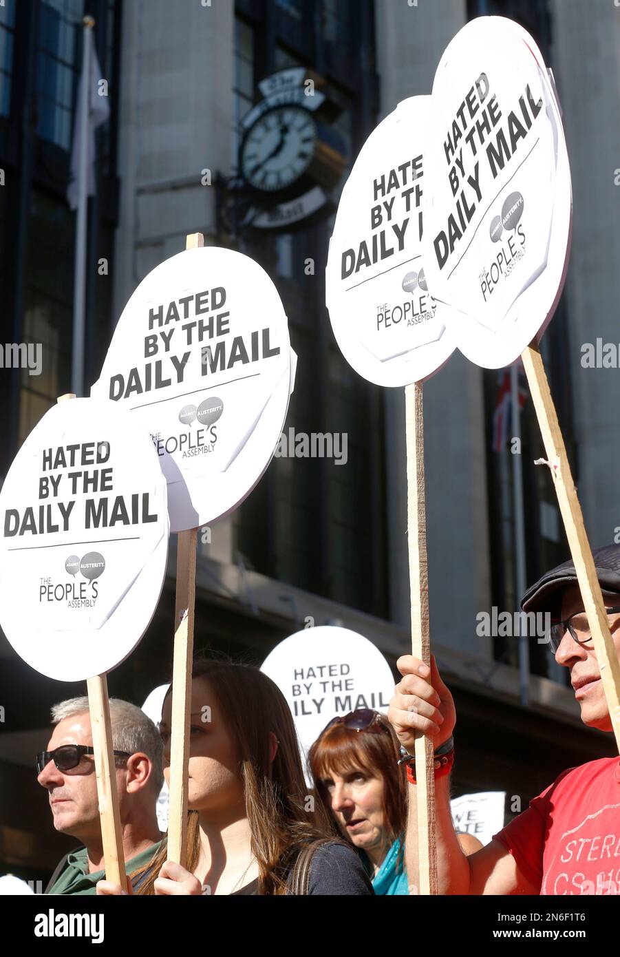 Demonstrators display placards, during a 'Daily Mail Hates Britain ...