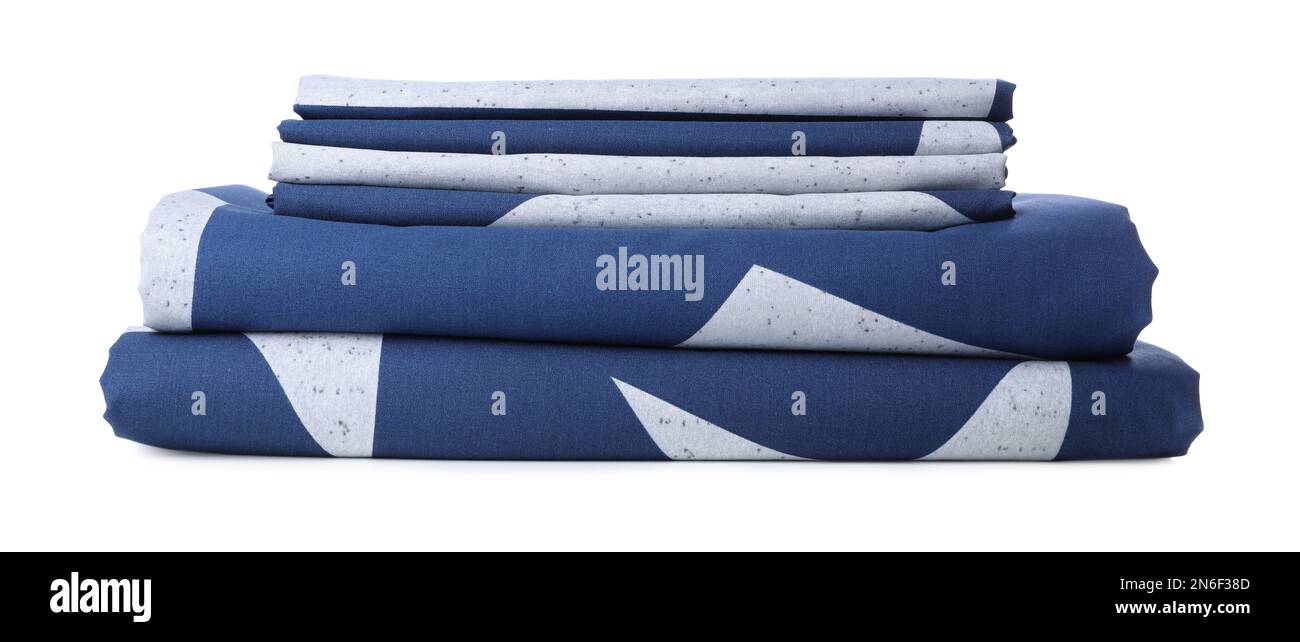 Stack of clean bed linens isolated on white. Child's room interior ...