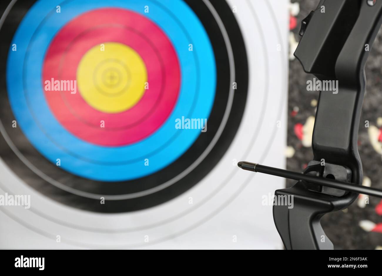 Bow with arrow aiming archery target, closeup Stock Photo - Alamy
