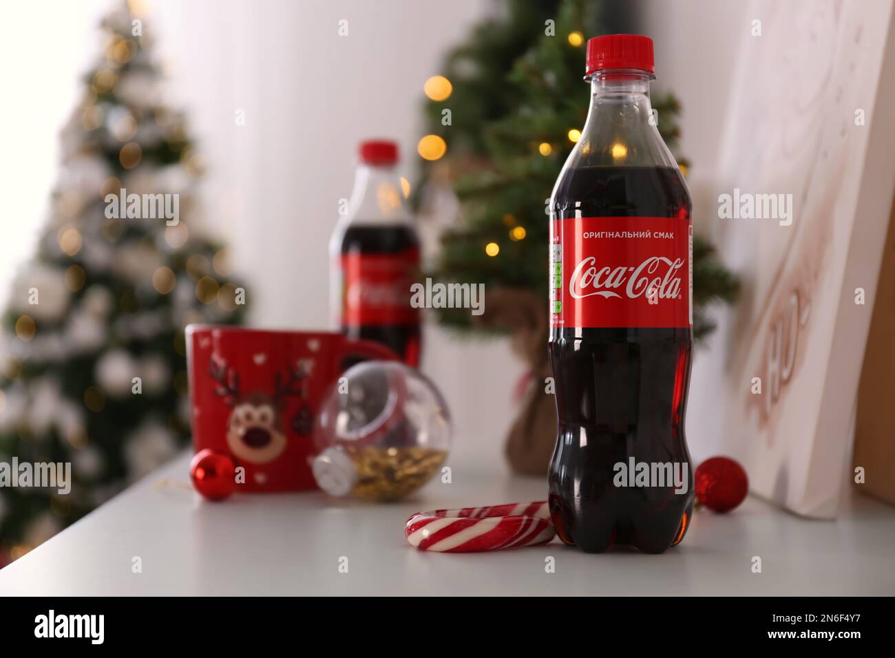 MYKOLAIV, UKRAINE - JANUARY 13, 2021: Bottle of Coca-Cola in room ...